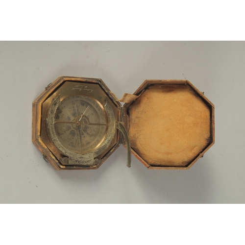 A GEORGIAN OCTAGONAL BRASS TRAVELLING COMPASS with silvered dial. Made ...