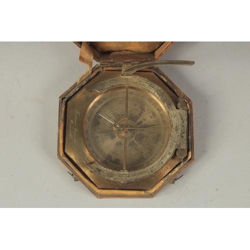 A GEORGIAN OCTAGONAL BRASS TRAVELLING COMPASS with silvered dial. Made ...
