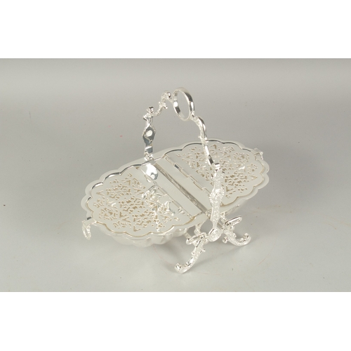 A SILVER PLATED SHELL CHEESE BISCUIT STAND.