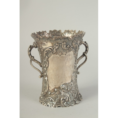A VICTORIAN REPOUSSE SILVER TWO HANDLED VASE. 6ins high, Sheffield 1900 ...