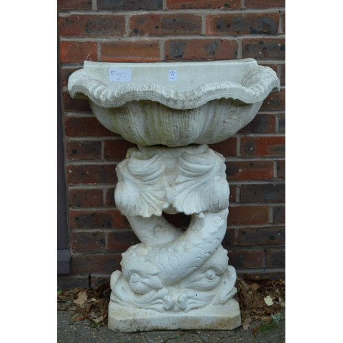 A white painted composite stone water feature.