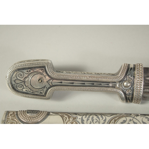 A VERY GOOD RUSSIAN SILVER HANDLE AND SHEATH DAGGER, dated 1894, with ...