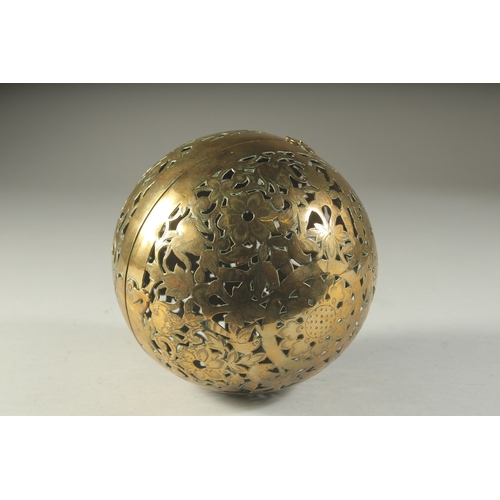 AN 18TH CENTURY BRASS PIERCED BALL POMANDER. 5.5ins diameter.