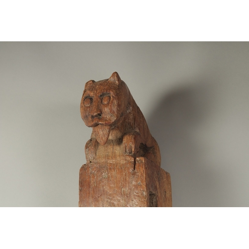 AN 18TH CENTURY CARVED WOOD COLUMN carved with a man and a lion. 26ins ...