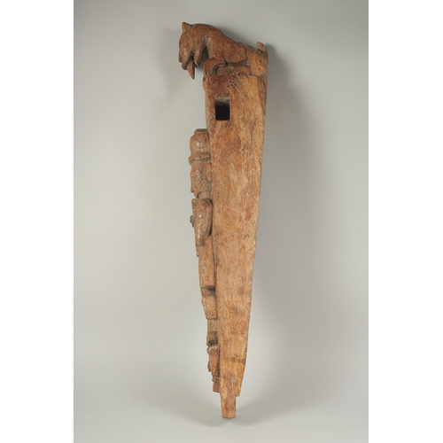 AN 18TH CENTURY CARVED WOOD COLUMN carved with a man and a lion. 26ins ...