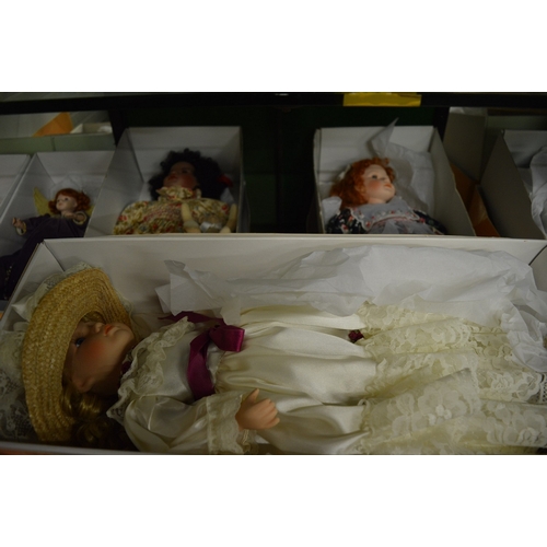 Three large boxed collectors dolls.