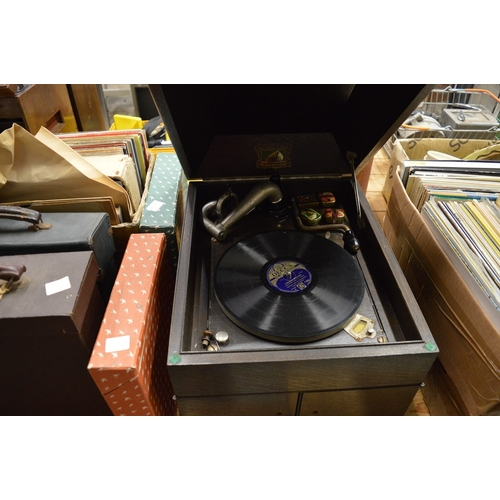 An old projector, record player, records, gramophone etc.