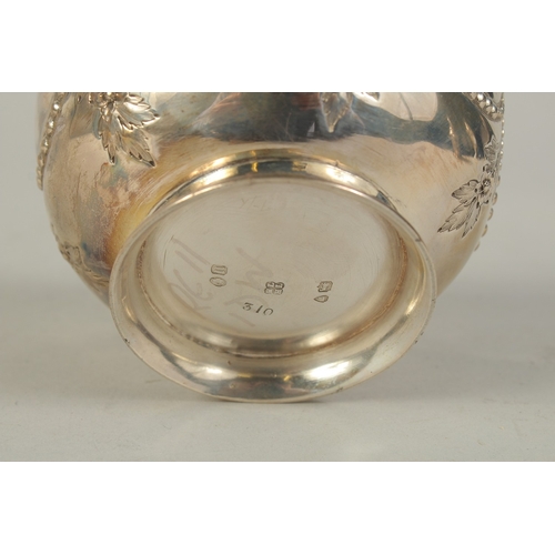 A VICTORIAN SILVER CIRCULAR BOWL repousse with flower and bead ...