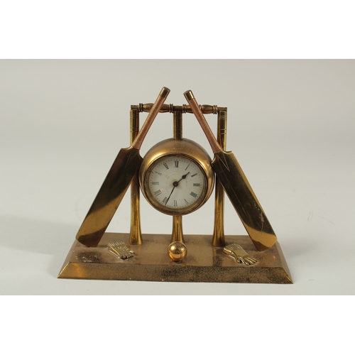 A NOVELTY CRICKET CLOCK formed as a ball, two bats, a stump and gloves ...
