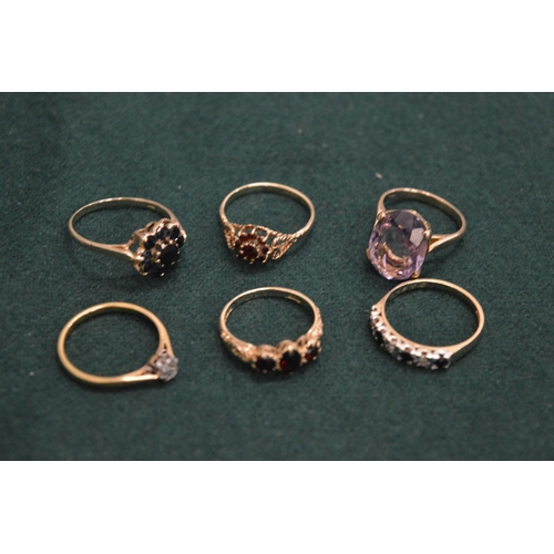 Group of gold and decorative rings.
