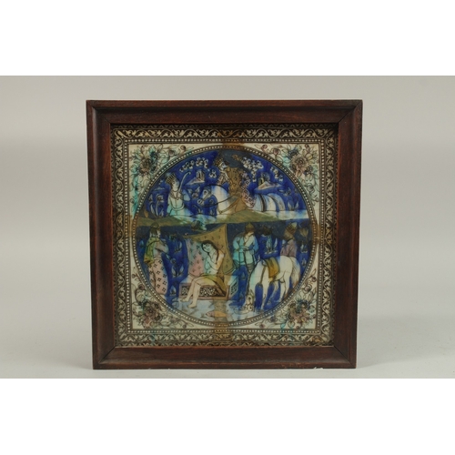 A 19TH CENTURY PERSIAN QAJAR GLAZED POTTERY TILE, the centre with ...