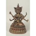 A BRONZE FIGURE OF A MULTI-ARMED DEITY, 17cm high.