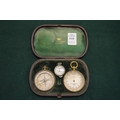 A Negretti & Zambra cased set of pocket barometer and compass together ...