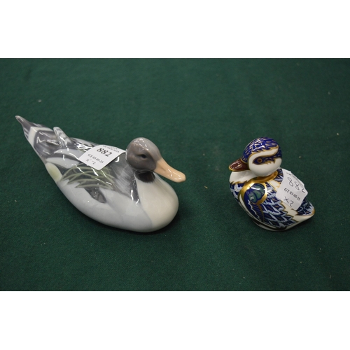 Royal Crown Derby duckling and a Royal Copenhagen duck.