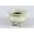 A CHINESE CELADON GREEN BOWL on curving legs. 4ins diameter.