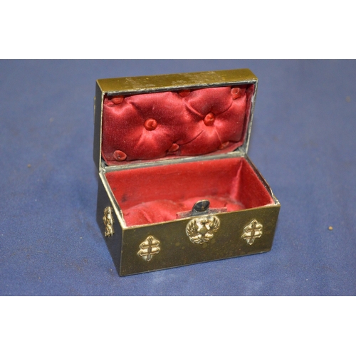 A small brass box.