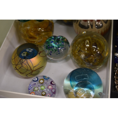 A collection of glass paperweights.