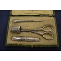 A cased silver manicure set.