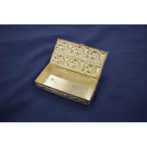 An embossed white metal box.