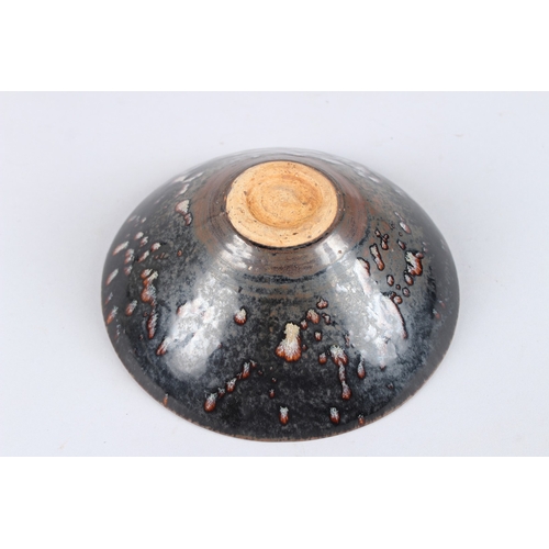 A CHINESE POTTERY BOWL decorated with goats. 6ins diameter.