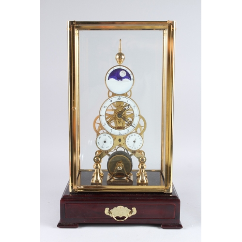 A REPRODUCTION BRASS AND ENAMEL SKELETON CLOCK, with moonphase movement ...