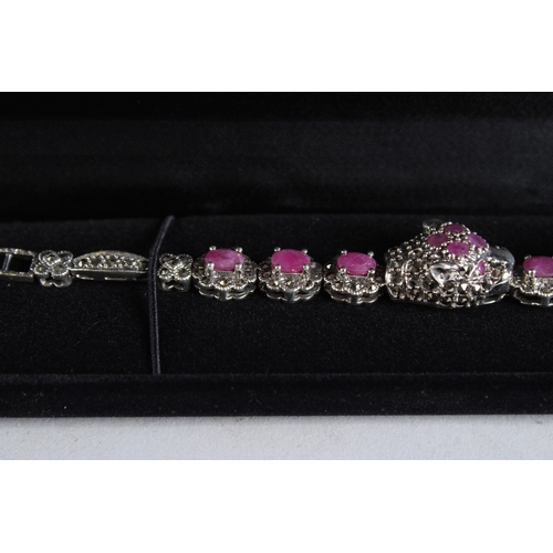 A SILVER RUBY SET AND MARCASITE DOUBLE PANTHER BRACELET.