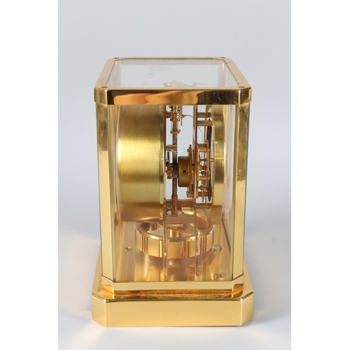 A JAEGER-LECOULTRE ATMOS CLOCK in a glass case. 23cms high.