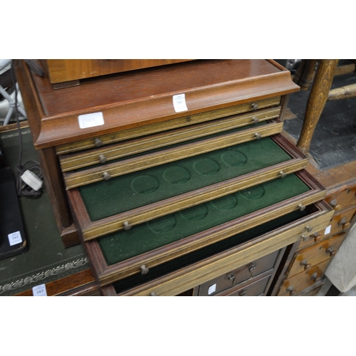 A mahogany table top coin collectors chest.
