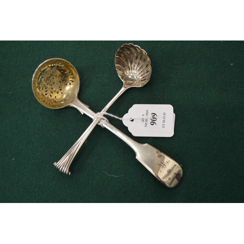 Two silver sifting spoons.