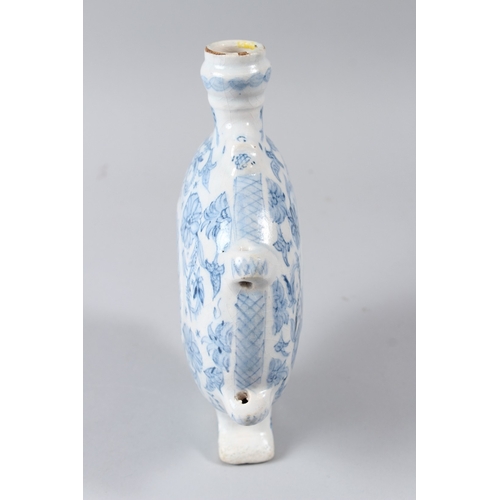 AN ISLAMIC POTTERY WATER FLASK, with blue painted floral decoration ...