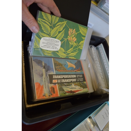A box of tea card albums.