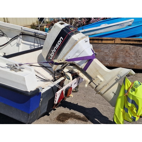 A dory boat and trailer with outboard motor, spare life jackets ...