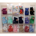 A collection of Beanie Babies, all presented in their perspex display ...