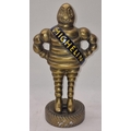 Cast metal painted Michelin man figure 28cm tall.