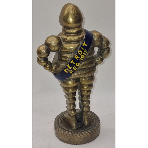 Cast metal painted Michelin man figure 28cm tall.