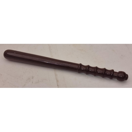 A vintage wooden police constables truncheon 40cm long.