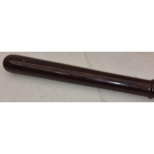 A vintage wooden police constables truncheon 40cm long.
