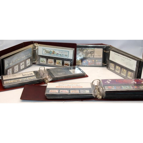Four albums of GB stamps presentation packs including £10 stamp