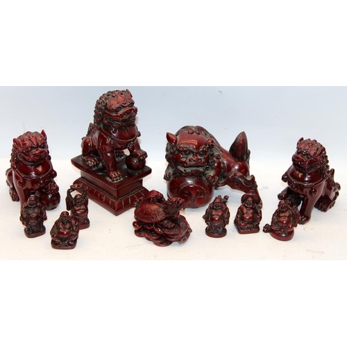A collection of red resin Oriental figures including Foo Dogs. 11 items ...