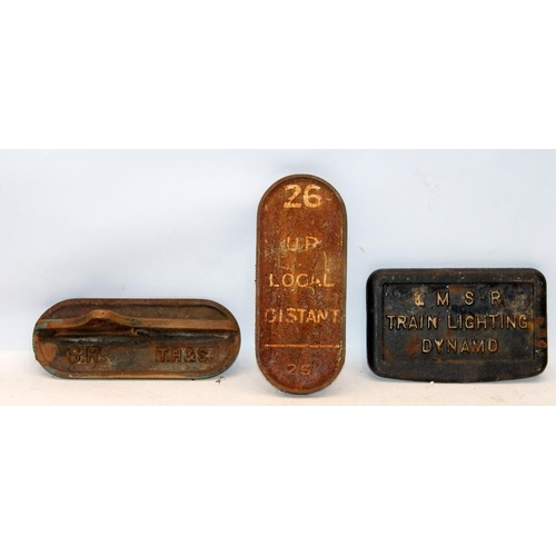 Three vintage cast metal railway signs, the largest being 23cms across