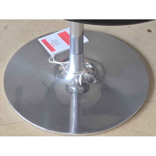 A pair of black gloss Kartell 4835, Ero|S| swivel egg chairs.