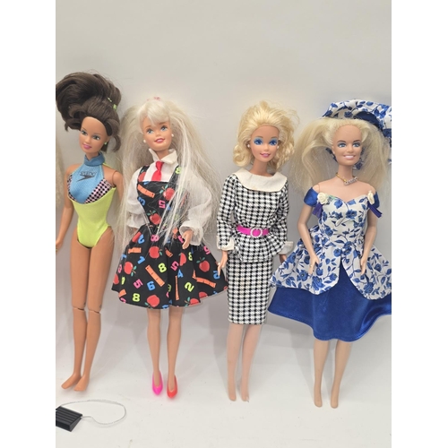A collection of fully dressed dolls to include Barbie and Sindy ...