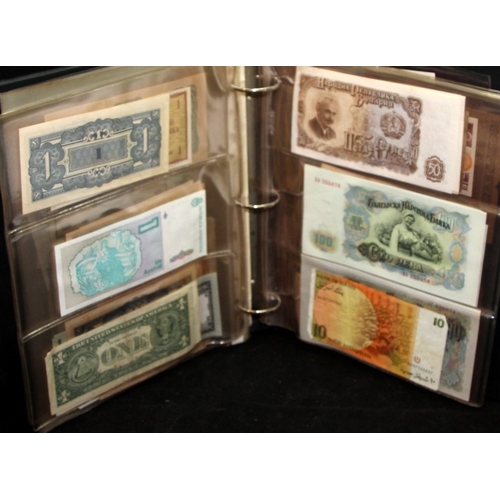 An album containing a good selection of World banknotes