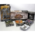 A collection of Warhammer figures, mostly in sealed packaging