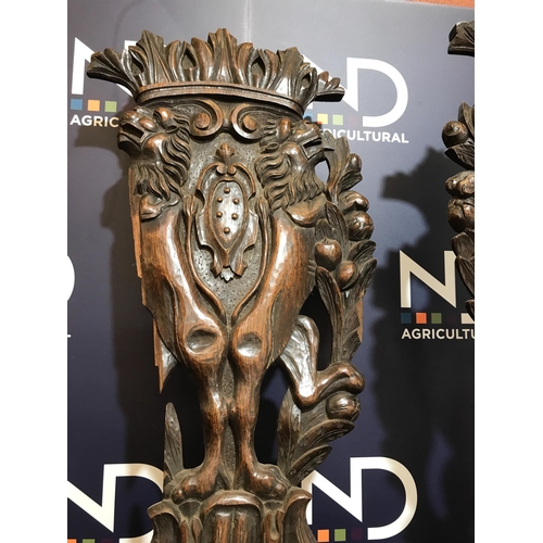 PAIR OF HEAVILY CARVED BLACK FOREST CHAIRS