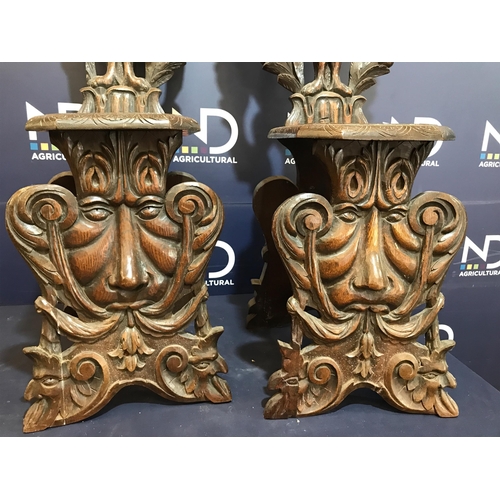 PAIR OF HEAVILY CARVED BLACK FOREST CHAIRS