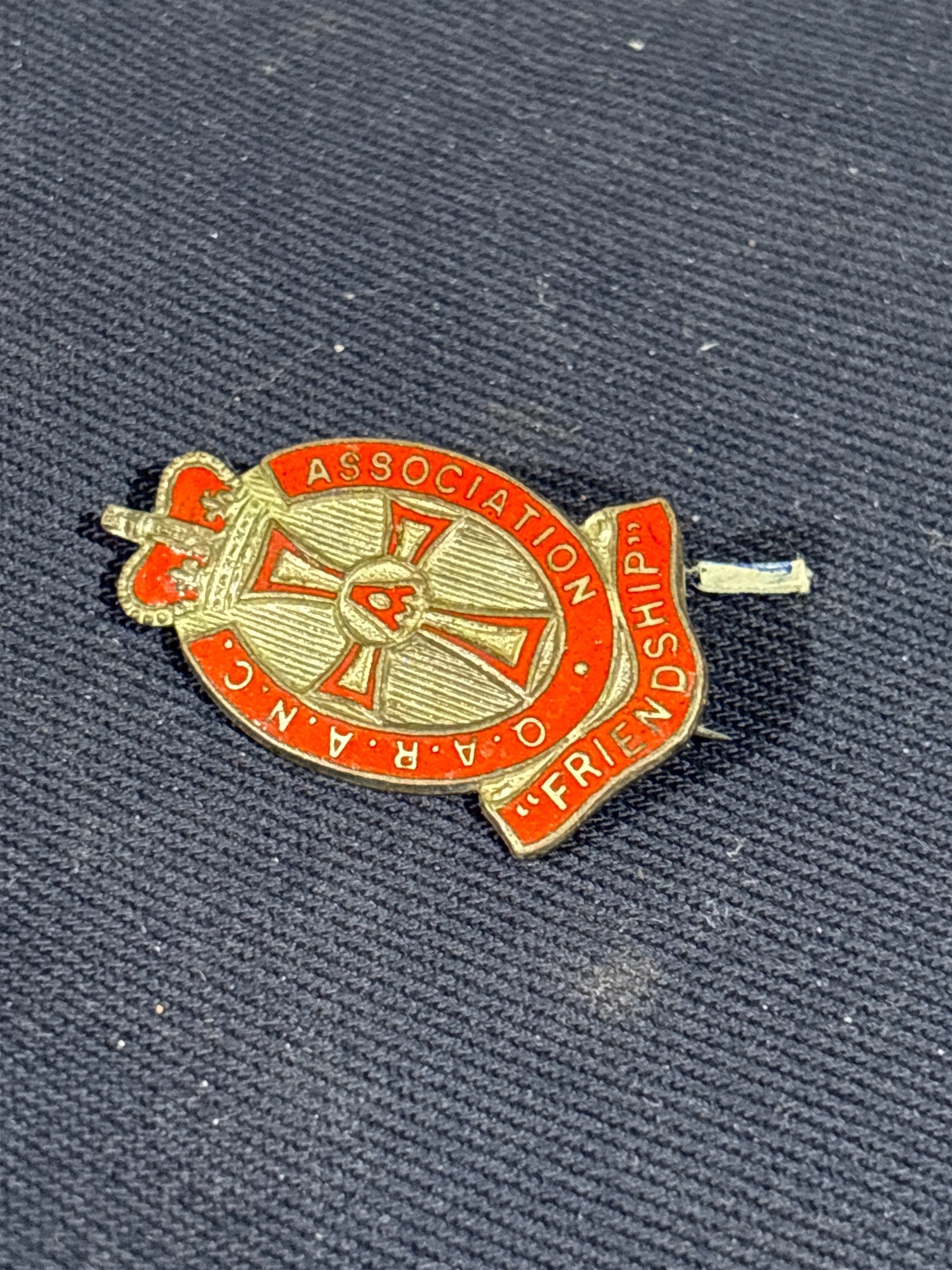ENAMELLED BADGE