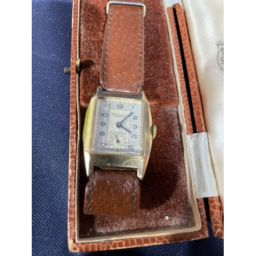 BRAVINGTONS LEATHER STRAP 9CT GOLD WATCH