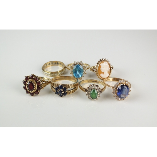 A collection of seven stone set rings, comprising; a 9ct gold garnet ...