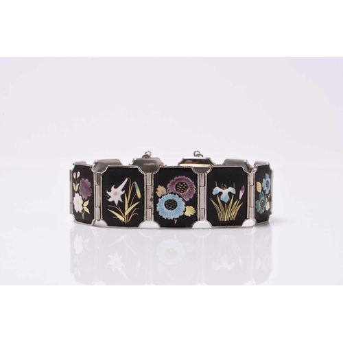 A white metal and enamel shakudo bracelet, together with a silver ...